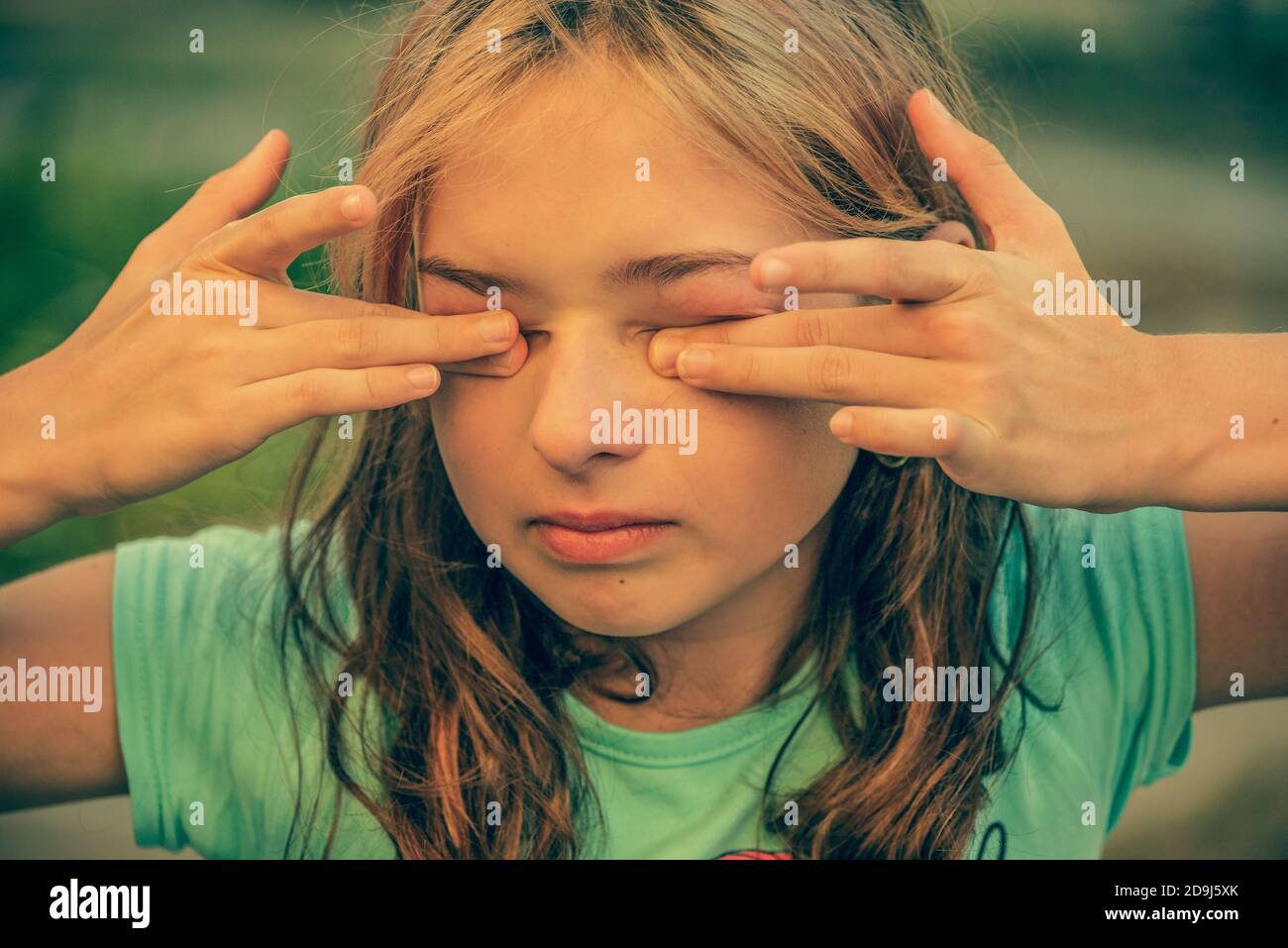 Beautiful sad little girl crying, on summer background. Girl crying ...