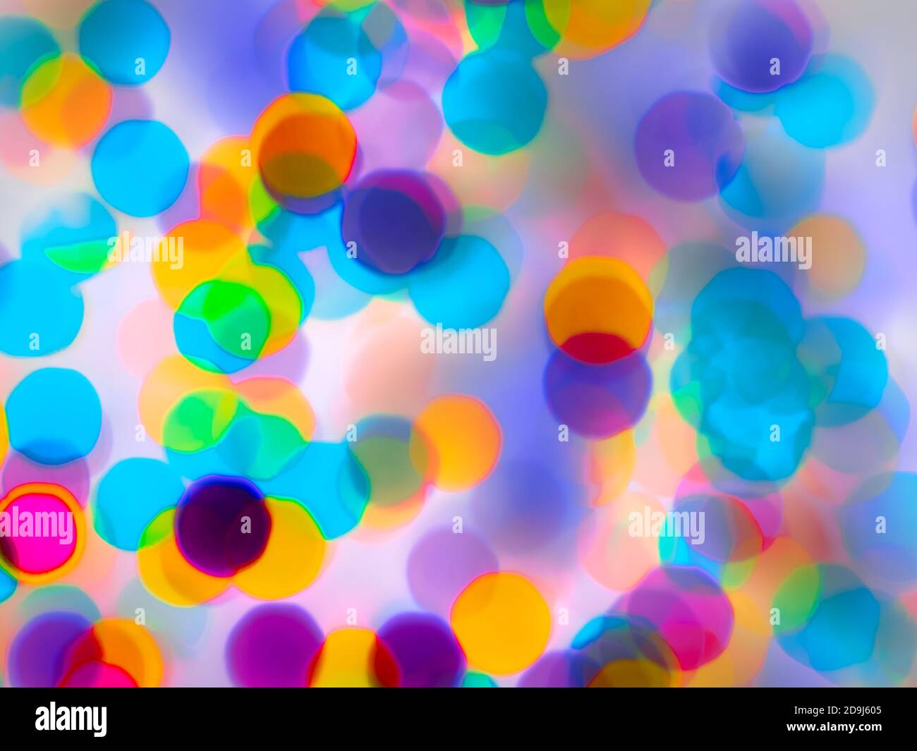bright round colored spots on a white background, unfocused background ...