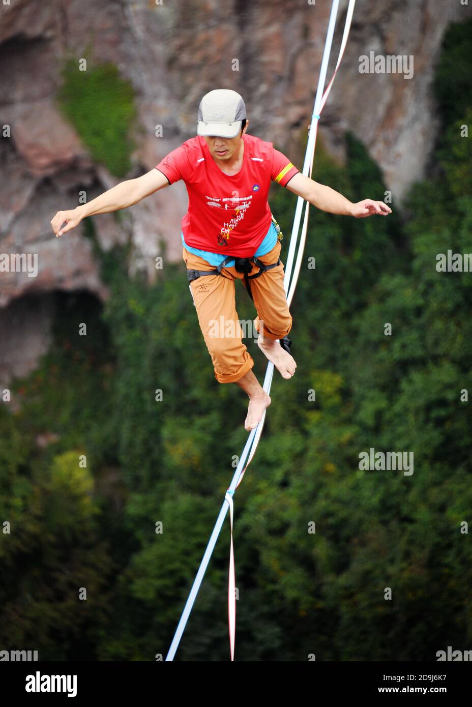 A slacking participant walks on a tight rope in the air at the 2020 ...