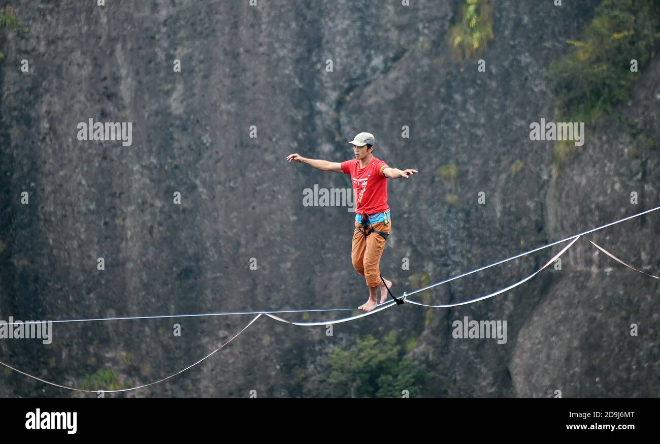 A slacking participant walks on a tight rope in the air at the 2020 ...