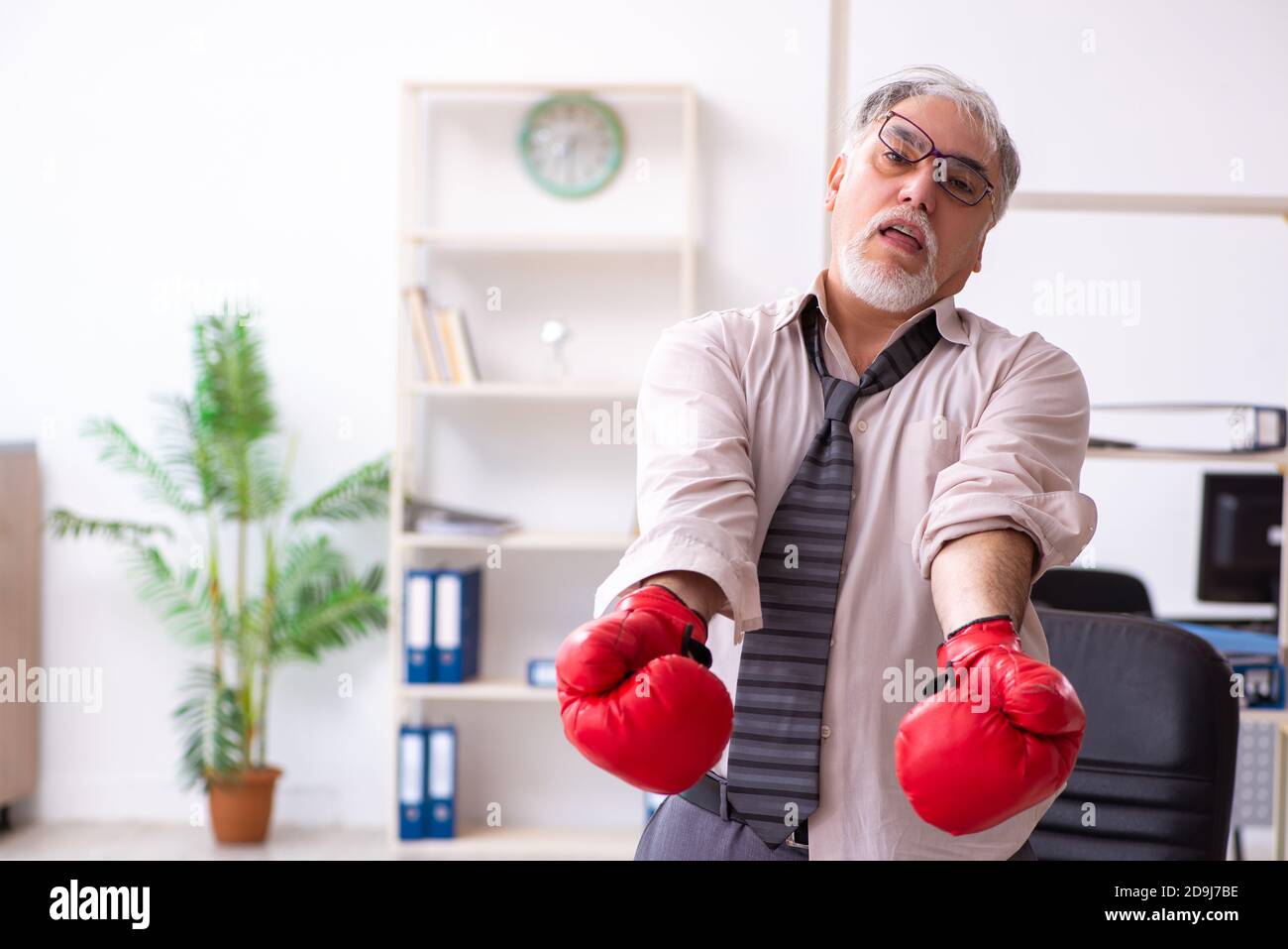 Businessman angry and furious at his workplace Stock Photo - Alamy