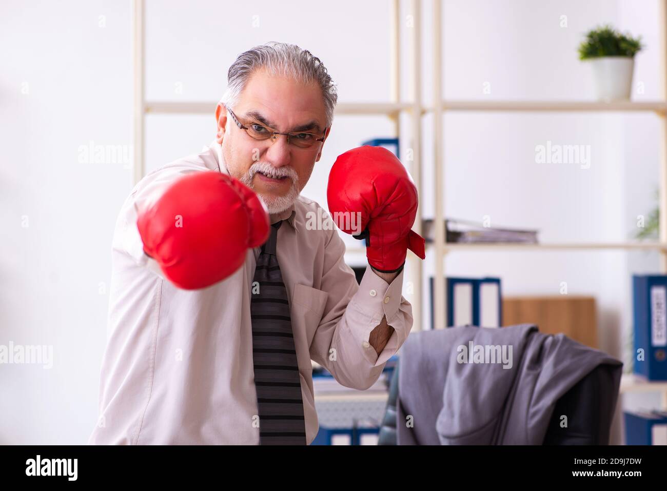 Businessman angry and furious at his workplace Stock Photo - Alamy