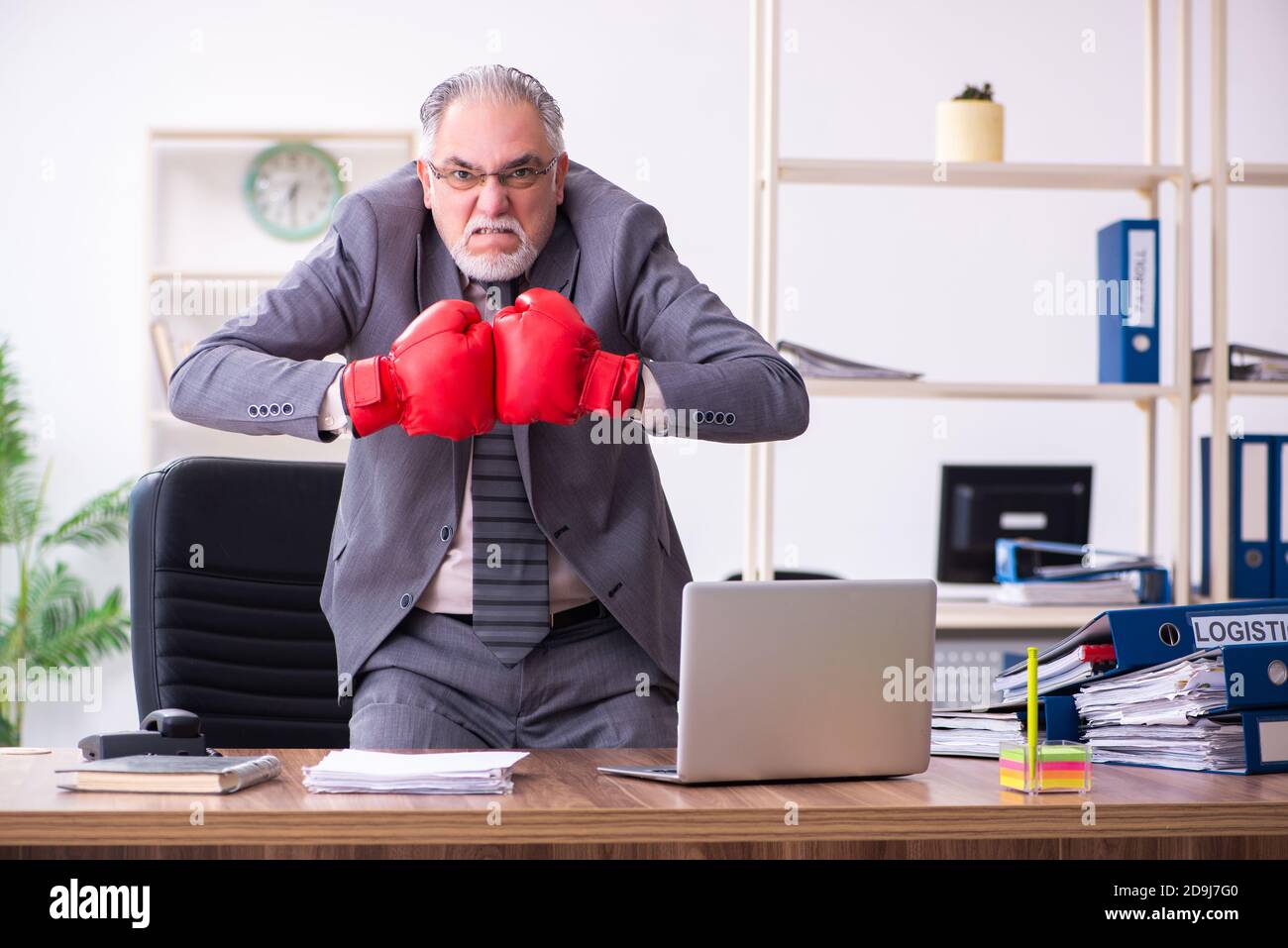 Businessman angry and furious at his workplace Stock Photo - Alamy