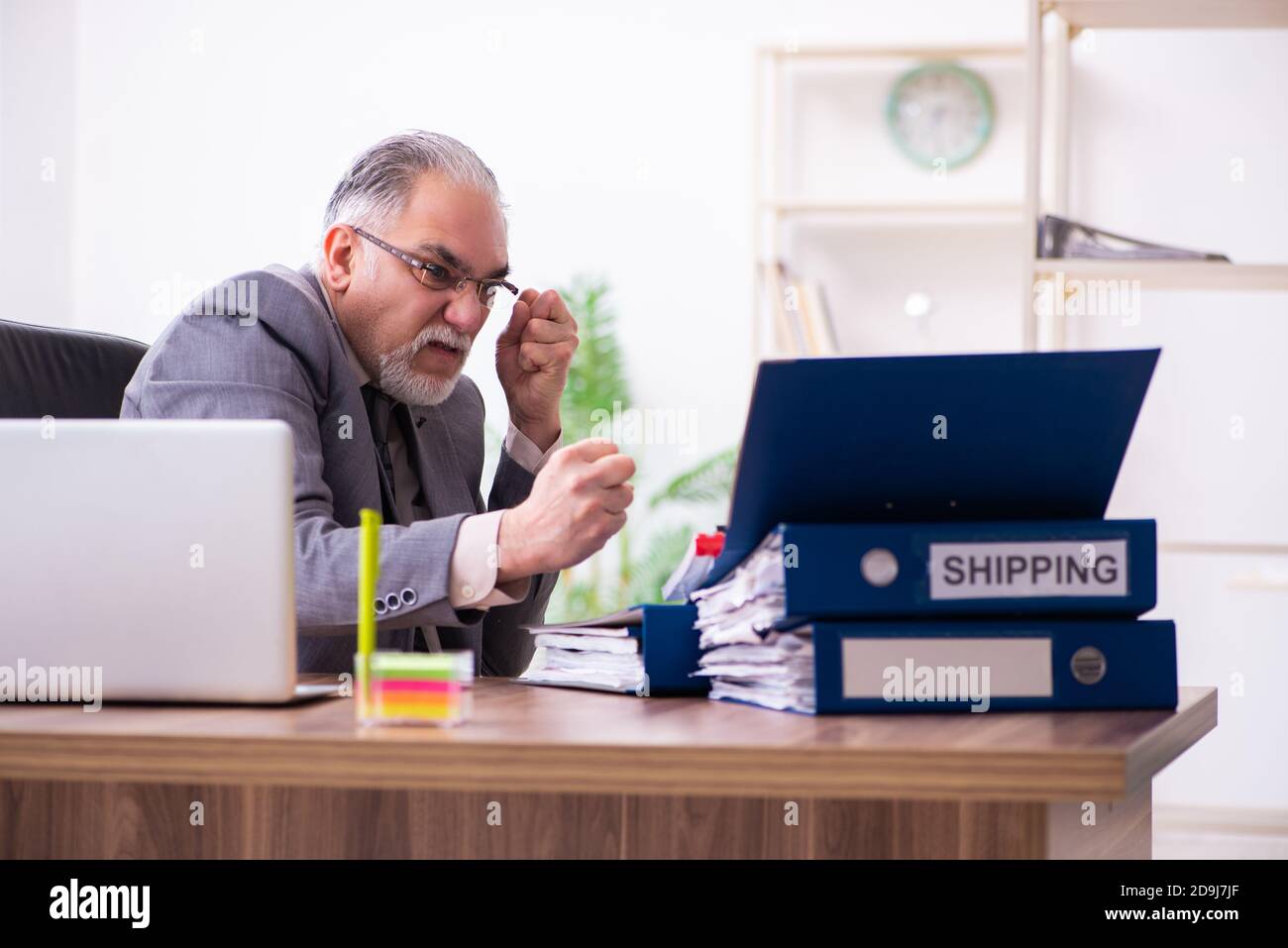 Businessman angry and furious at his workplace Stock Photo - Alamy