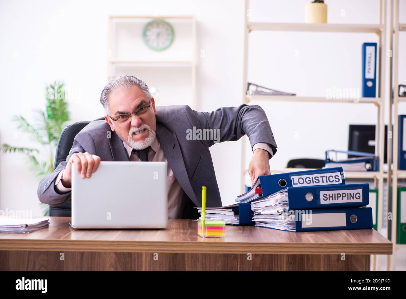 Businessman angry and furious at his workplace Stock Photo - Alamy