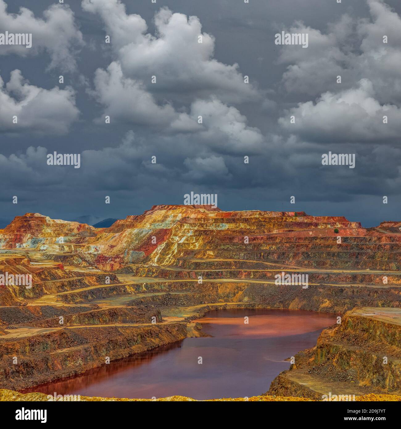 Copper mine with pond under the cloudscape Stock Photo - Alamy
