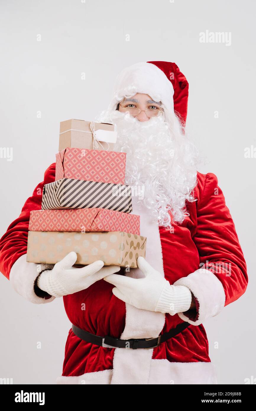 Happy satisfied Santa Claus with hands full of presents Stock Photo - Alamy
