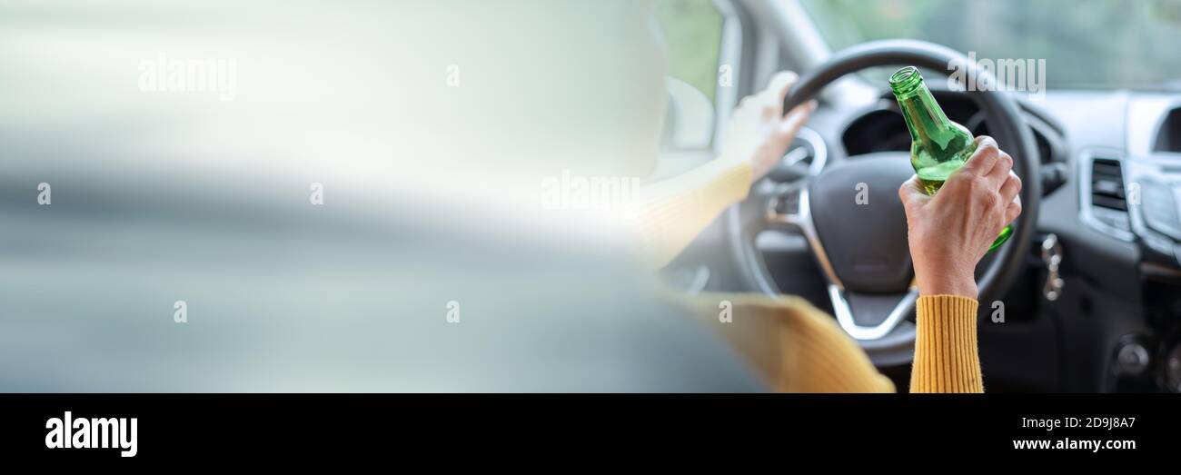 Woman drinking alcohol while driving; panoramic banner Stock Photo - Alamy