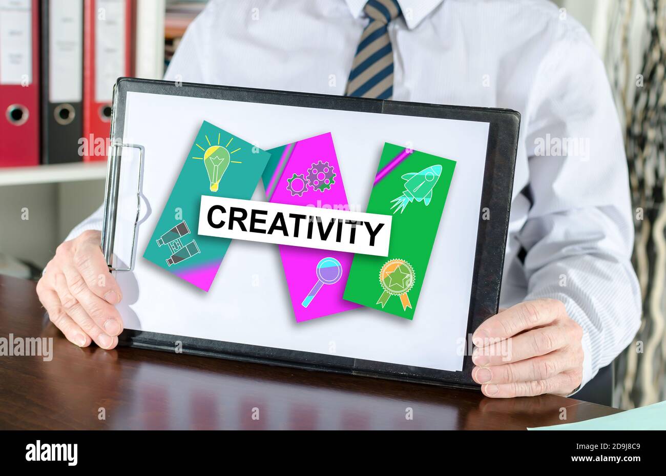 Creativity concept shown by a businessman Stock Photo - Alamy