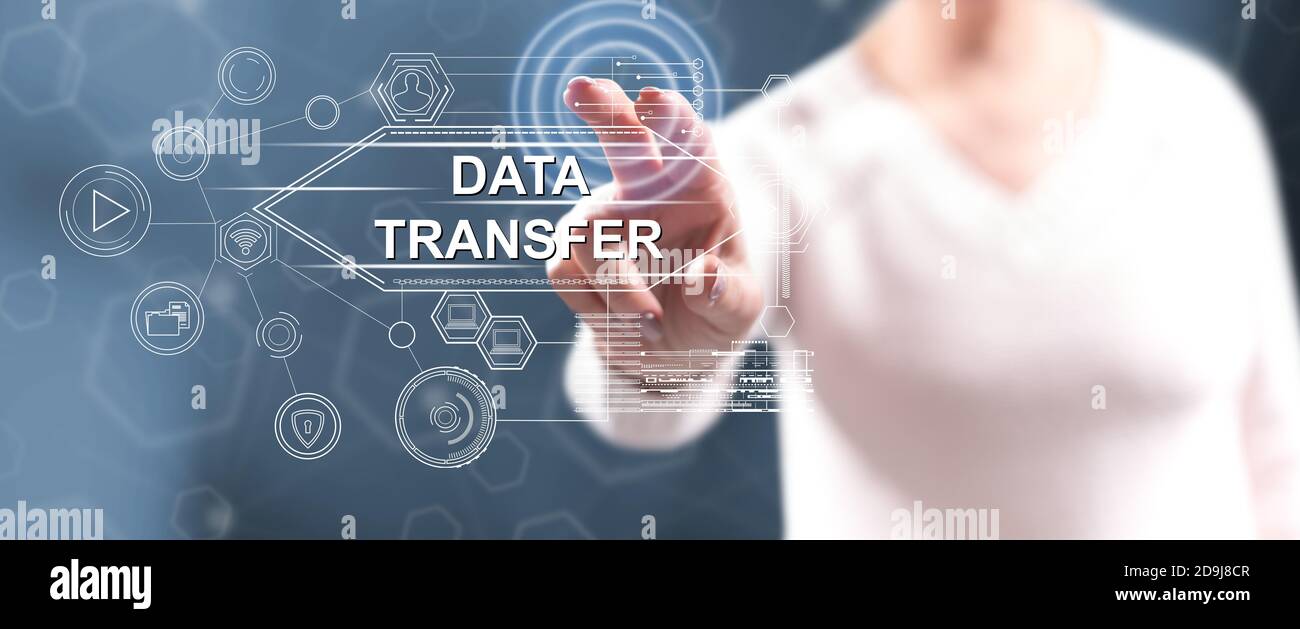 Woman touching a data transfer concept on a touch screen with her ...