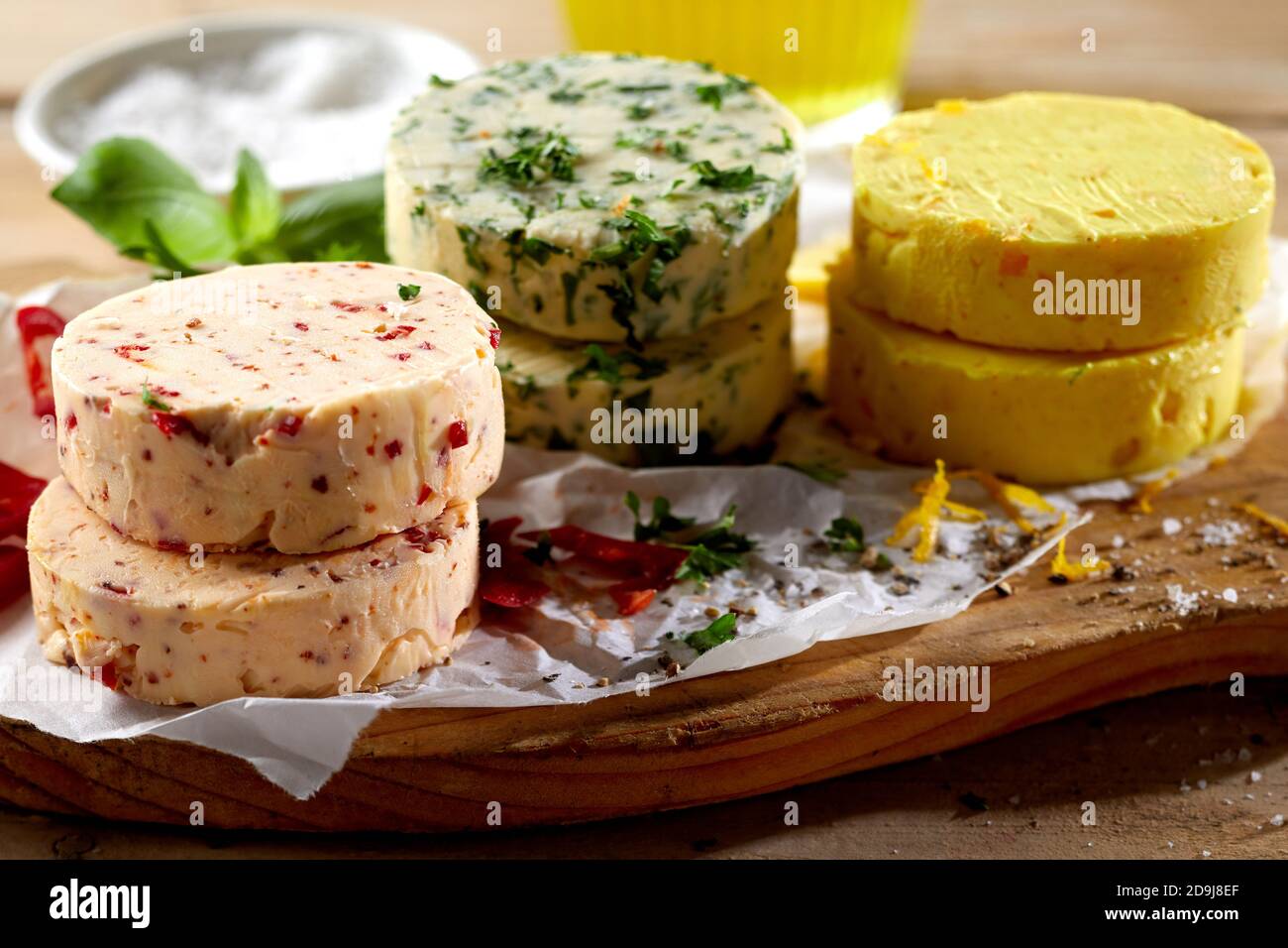 Assorted flavors of savory butter pats with ingredients including chili ...