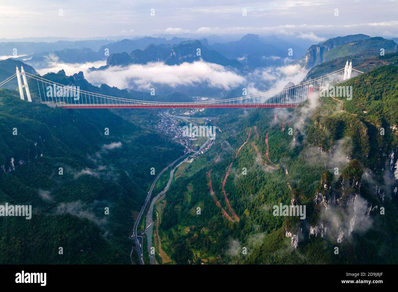 The sea of clouds appears around the Aizhai Suspension Bridge in Aizhai ...