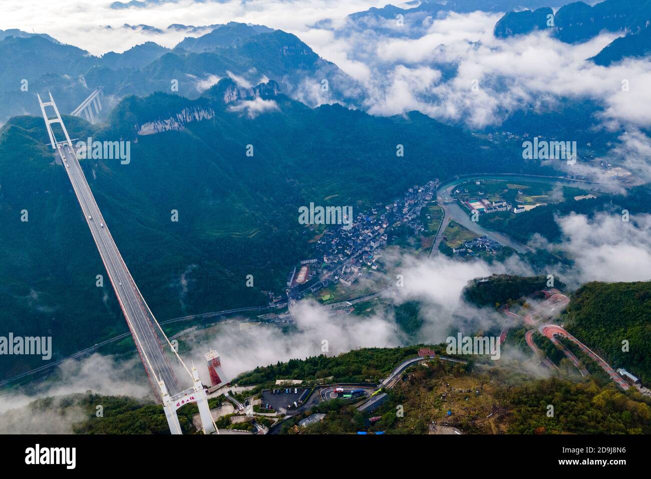 The sea of clouds appears around the Aizhai Suspension Bridge in Aizhai ...