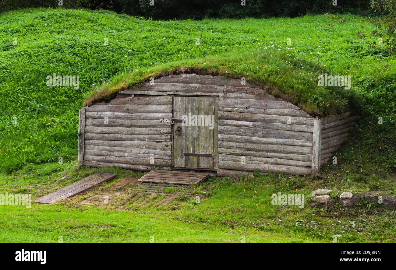 Old wooden cellar in hill covered with green grass Stock Photo - Alamy