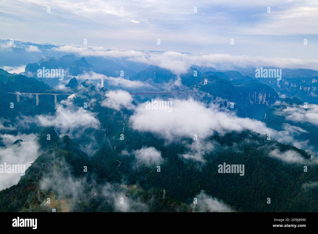 The sea of clouds appears around the Aizhai Suspension Bridge in Aizhai ...