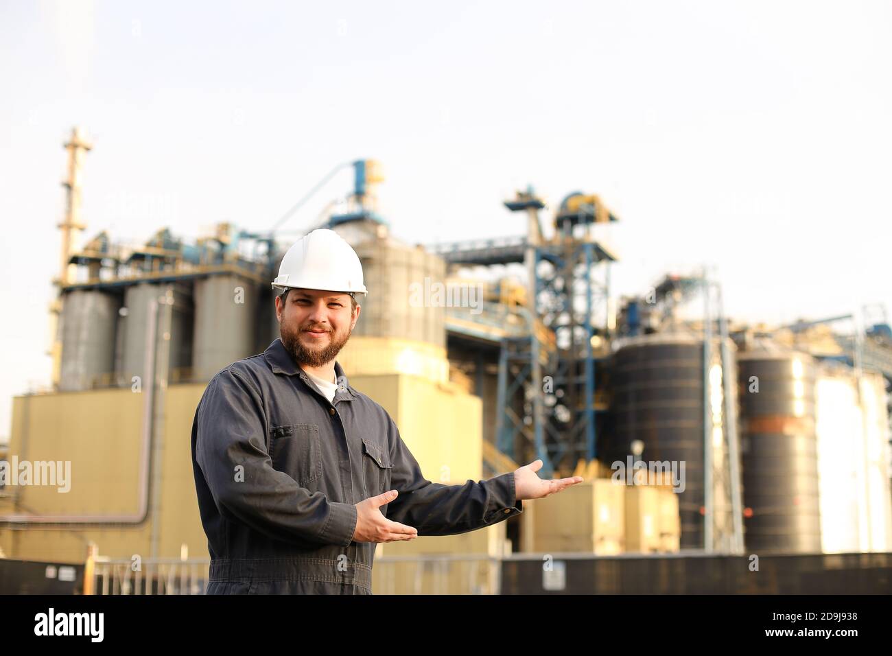 Portrait of industrial worker and engineer showing factory exterior ...