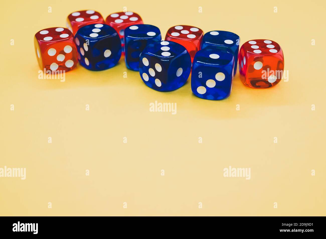 Top view of red and blue dice isolated on yellow background Stock Photo ...