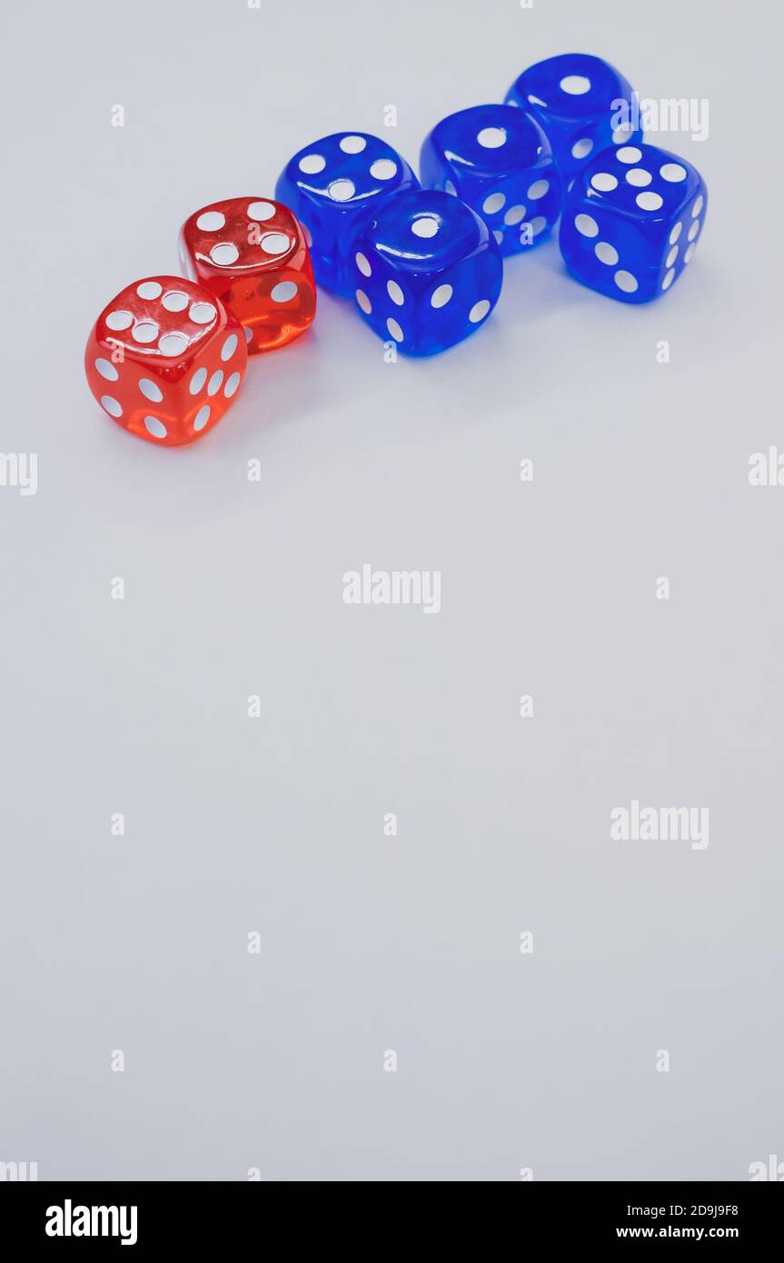 Vertical shot of red and blue dice isolated on white background Stock ...