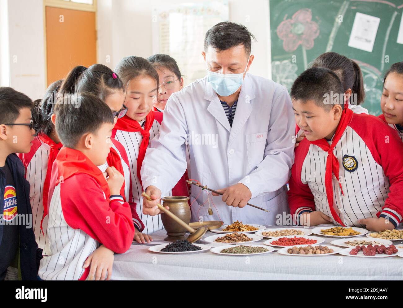 A herbalist teaches students knowledge of traditional Chinese medicine ...