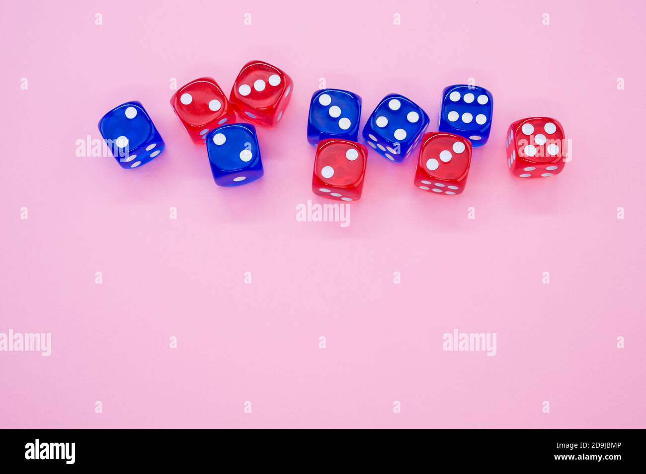 Top view of red and blue dice isolated on light pink background Stock ...
