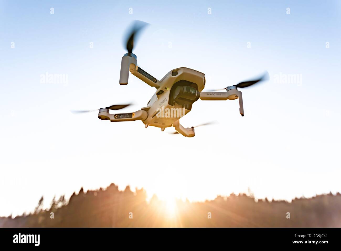 Close up shoot of a DJI Quadcopter Drone Mavic mini 249g. Drone flying ...