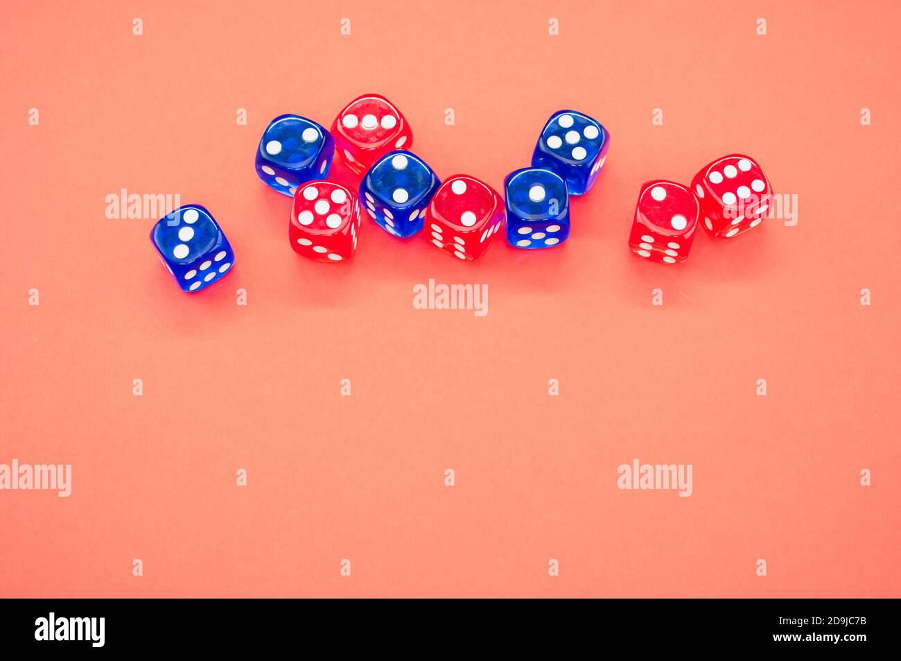 Top view of red and blue dice isolated on light orange background Stock ...