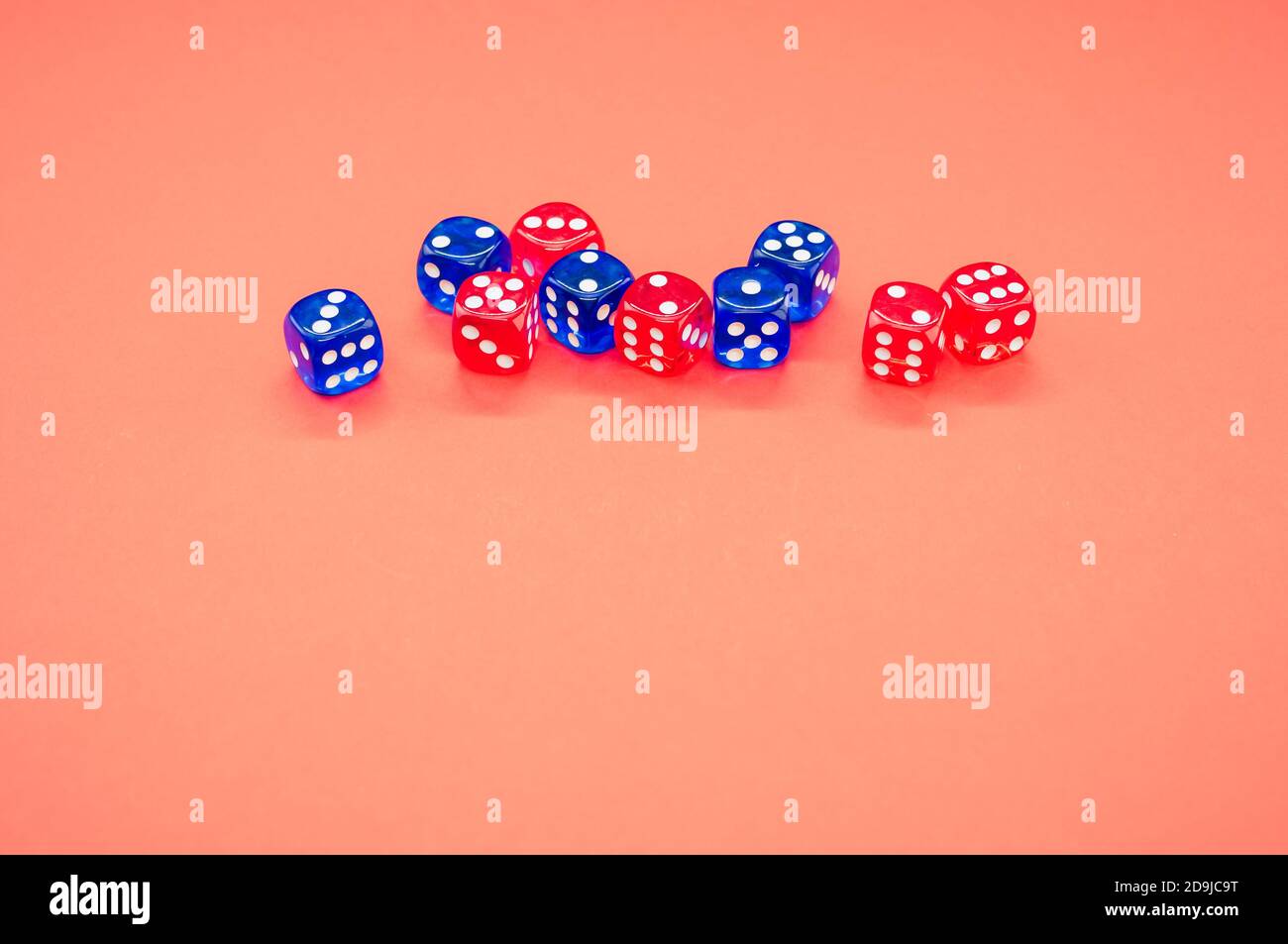Top view of red and blue dice isolated on light orange background Stock ...
