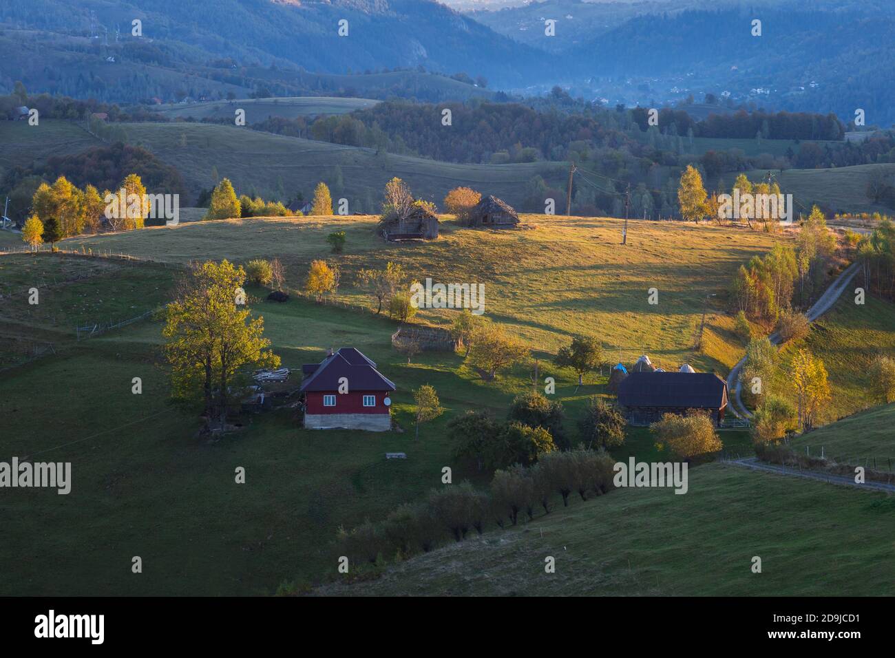Autumn rural scene of the Romanian village in Transylvania, at the foot ...