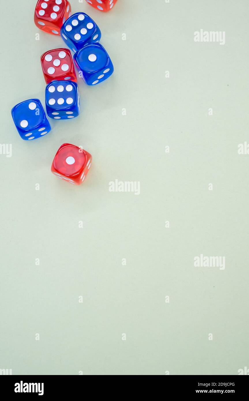 Vertical shot of red and blue dice isolated on white background Stock ...