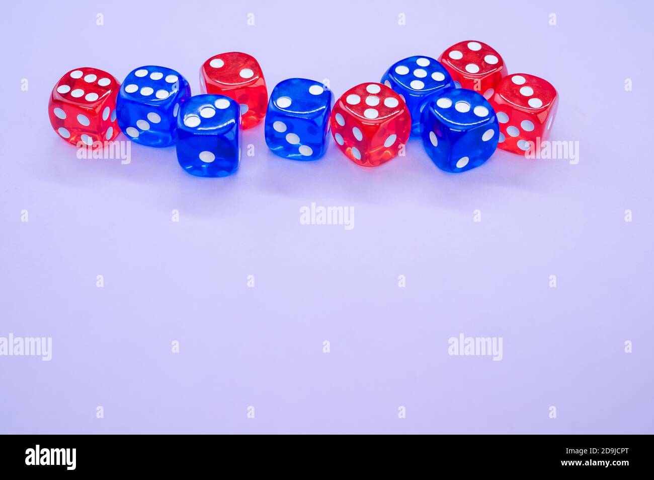 Top view of red and blue dice isolated on light violet background Stock ...