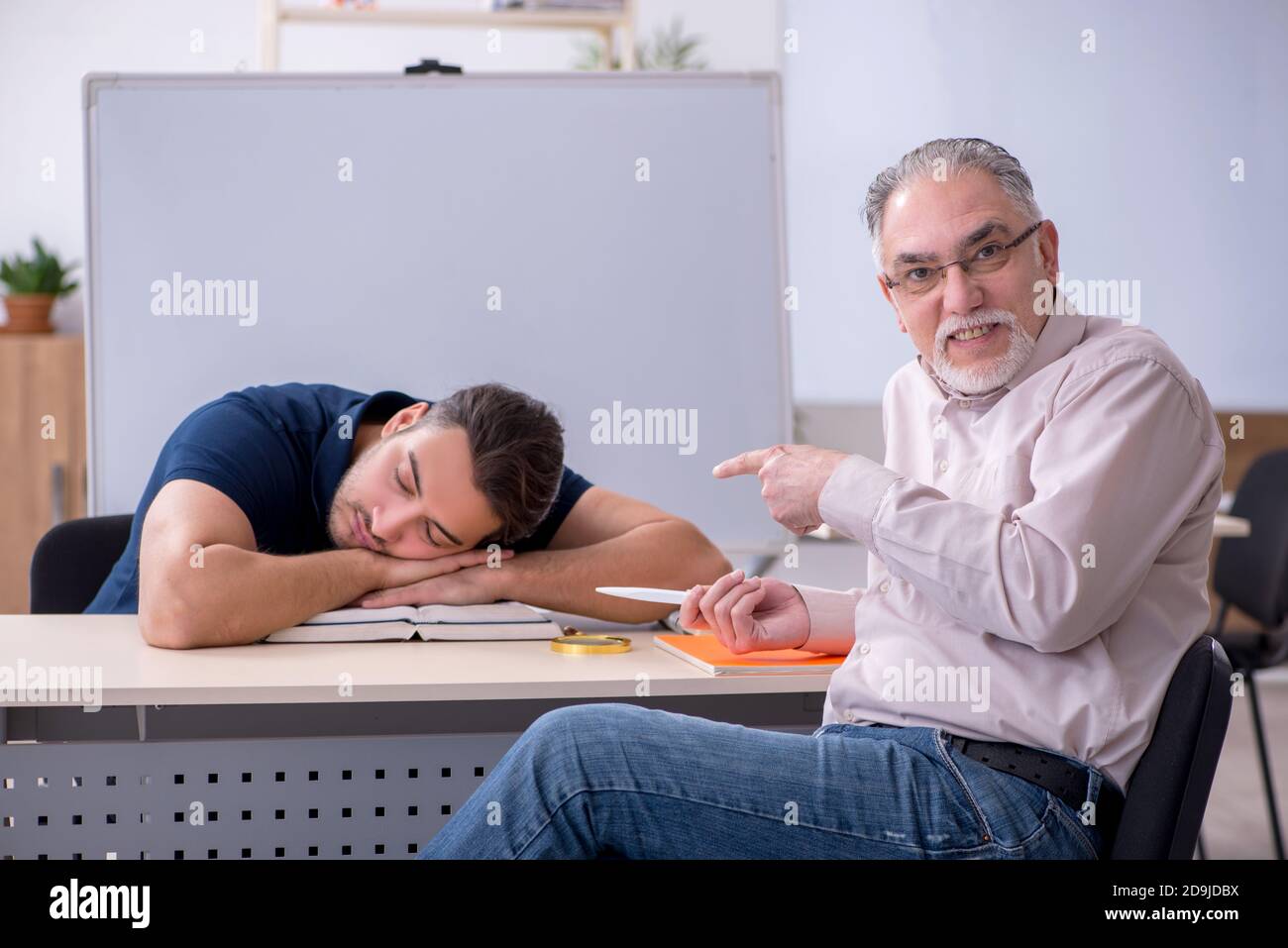 Old teacher and young student in the classroom Stock Photo - Alamy