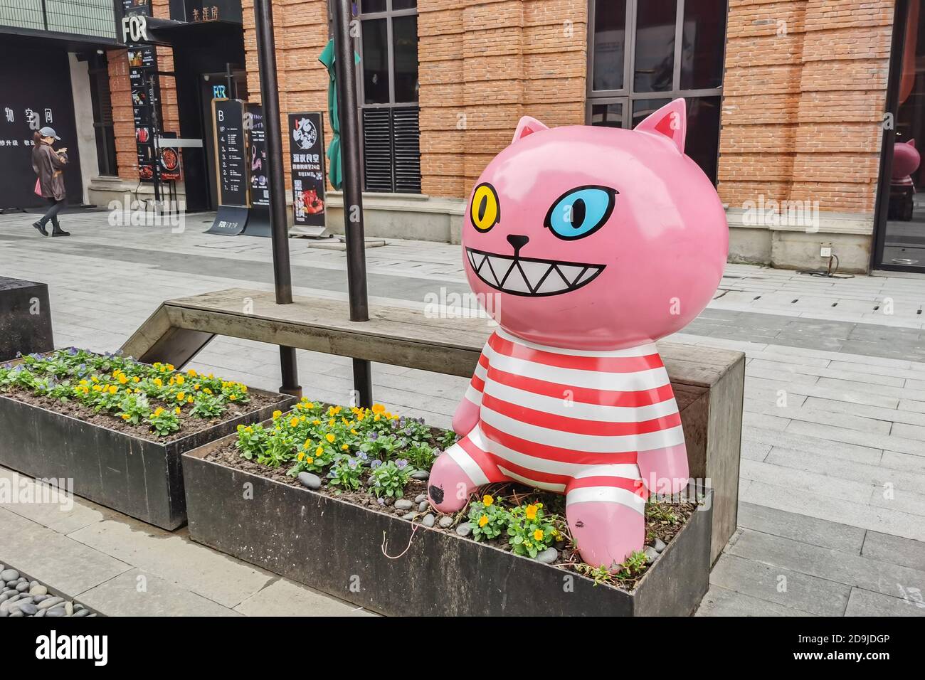 A giant Kuncat model is set up by the gate of a shopping mall to ...