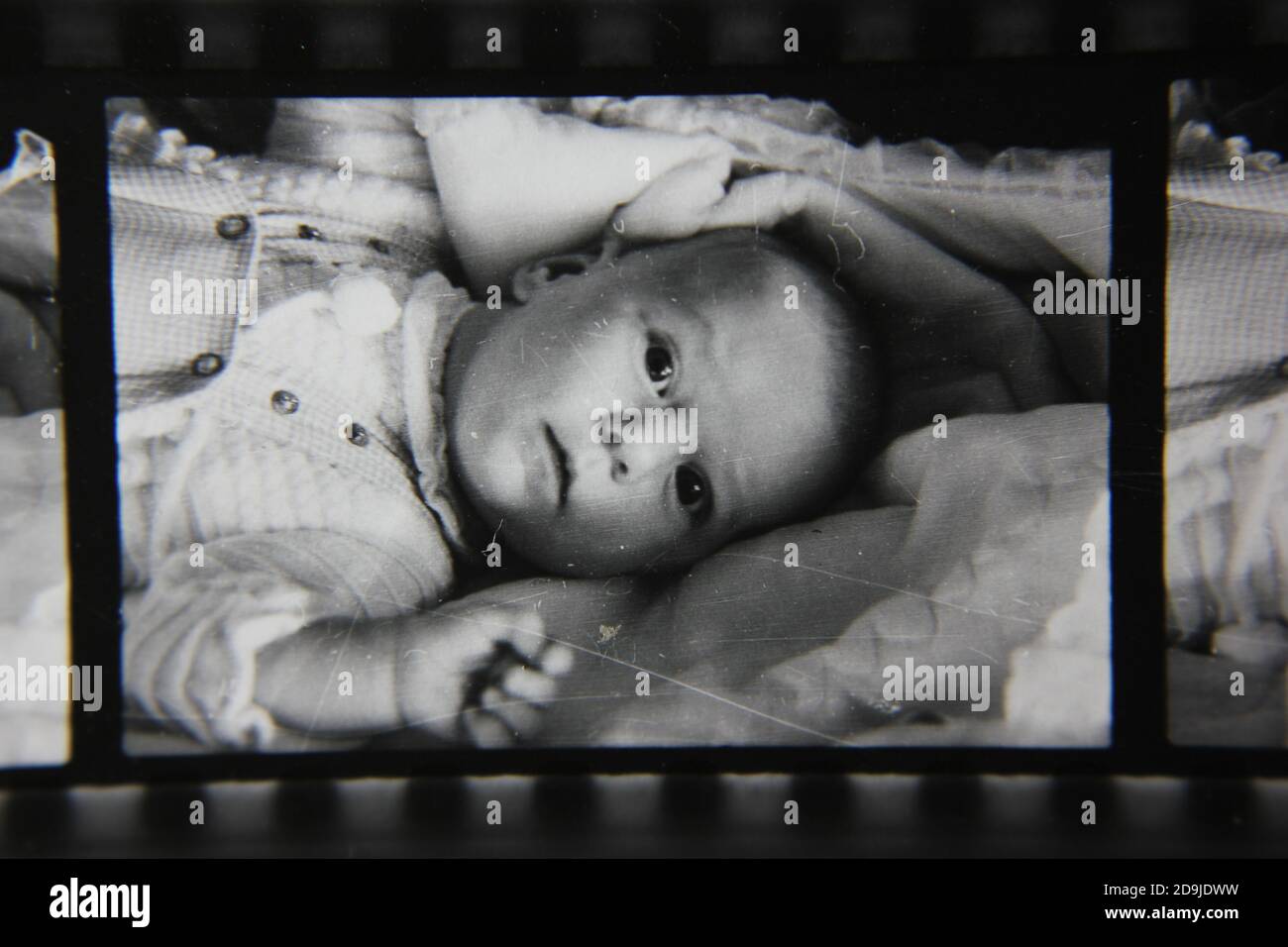 Fine 1970s vintage black and white photography of a small baby laying ...