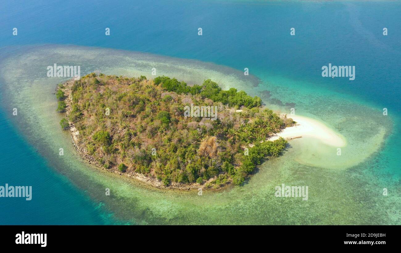 Tropical island with sandy beach on the Zamboanga Peninsula. Simoadang ...