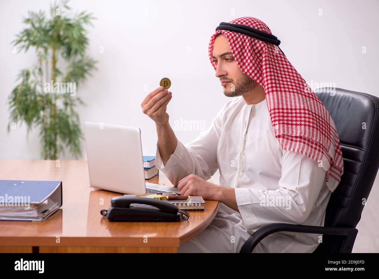 Male arab employee working in the office Stock Photo - Alamy