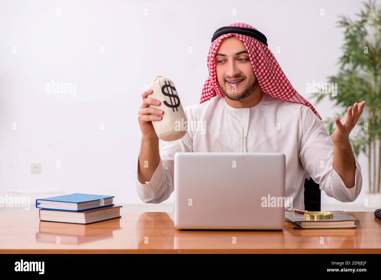 Male arab employee working in the office Stock Photo - Alamy