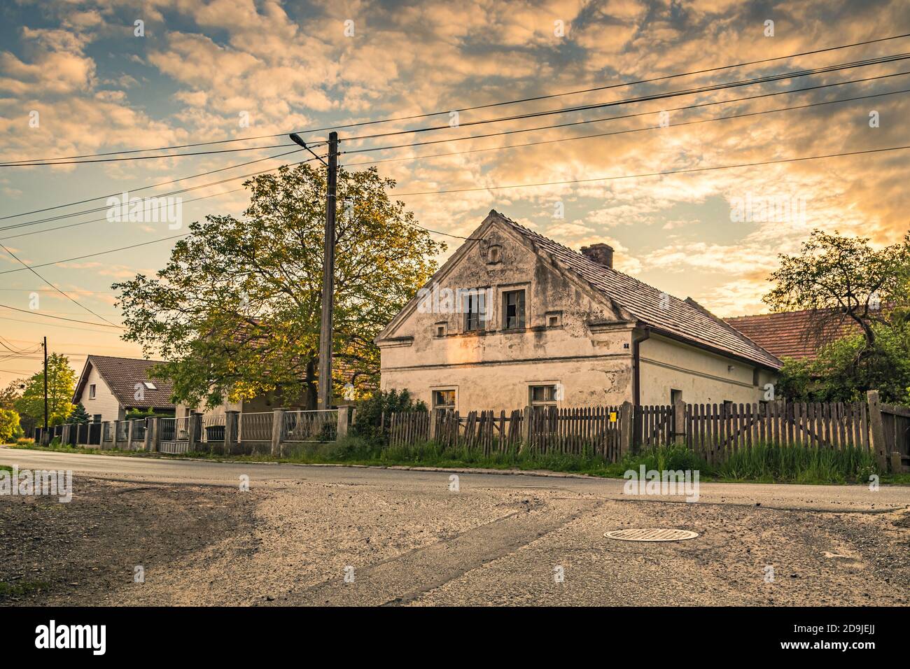 Low-angle village shot with a dramatic sky overhead Stock Photo - Alamy