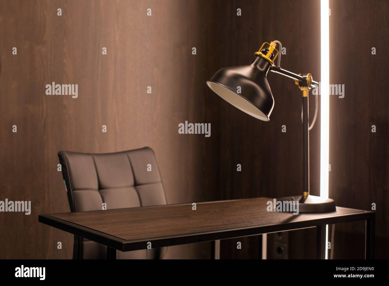 Chair and table with lamp Stock Photo - Alamy