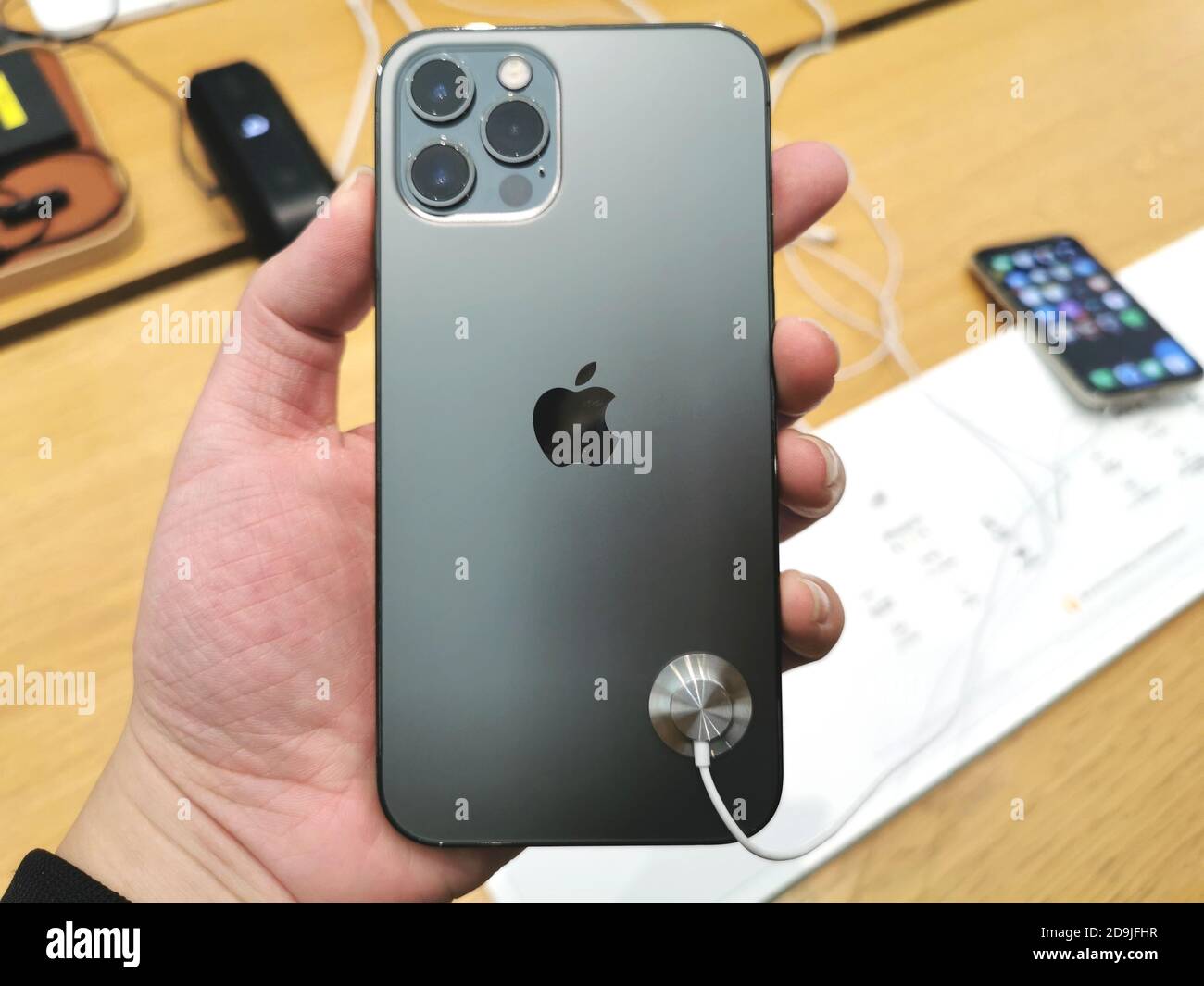 An iPhone of the new 12 series is on display at a flagship in Shanghai ...