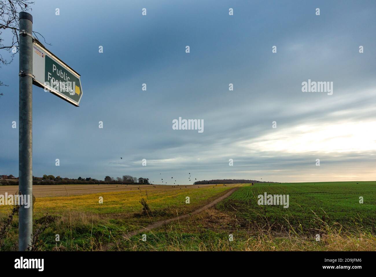 Public footpath sign showing the direction of pathway Stock Photo - Alamy