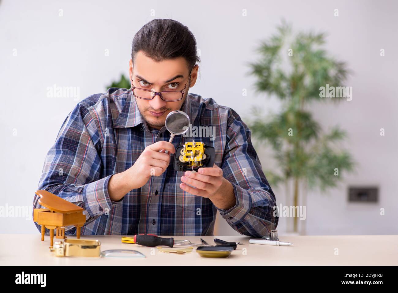 Watchmaker with loupe hi-res stock photography and images - Alamy