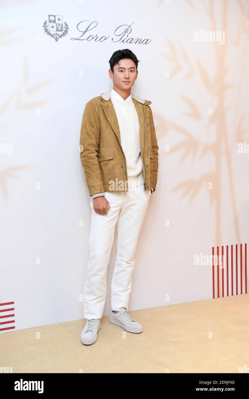 Chinese former competitive swimmer Ning Zetao poses for photos at the ...