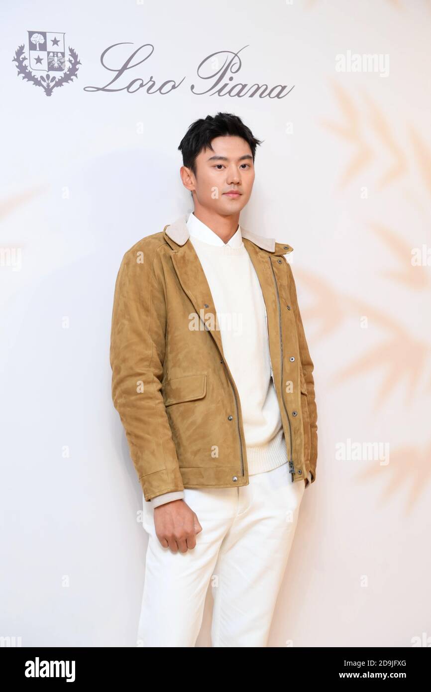 Chinese former competitive swimmer Ning Zetao poses for photos at the ...