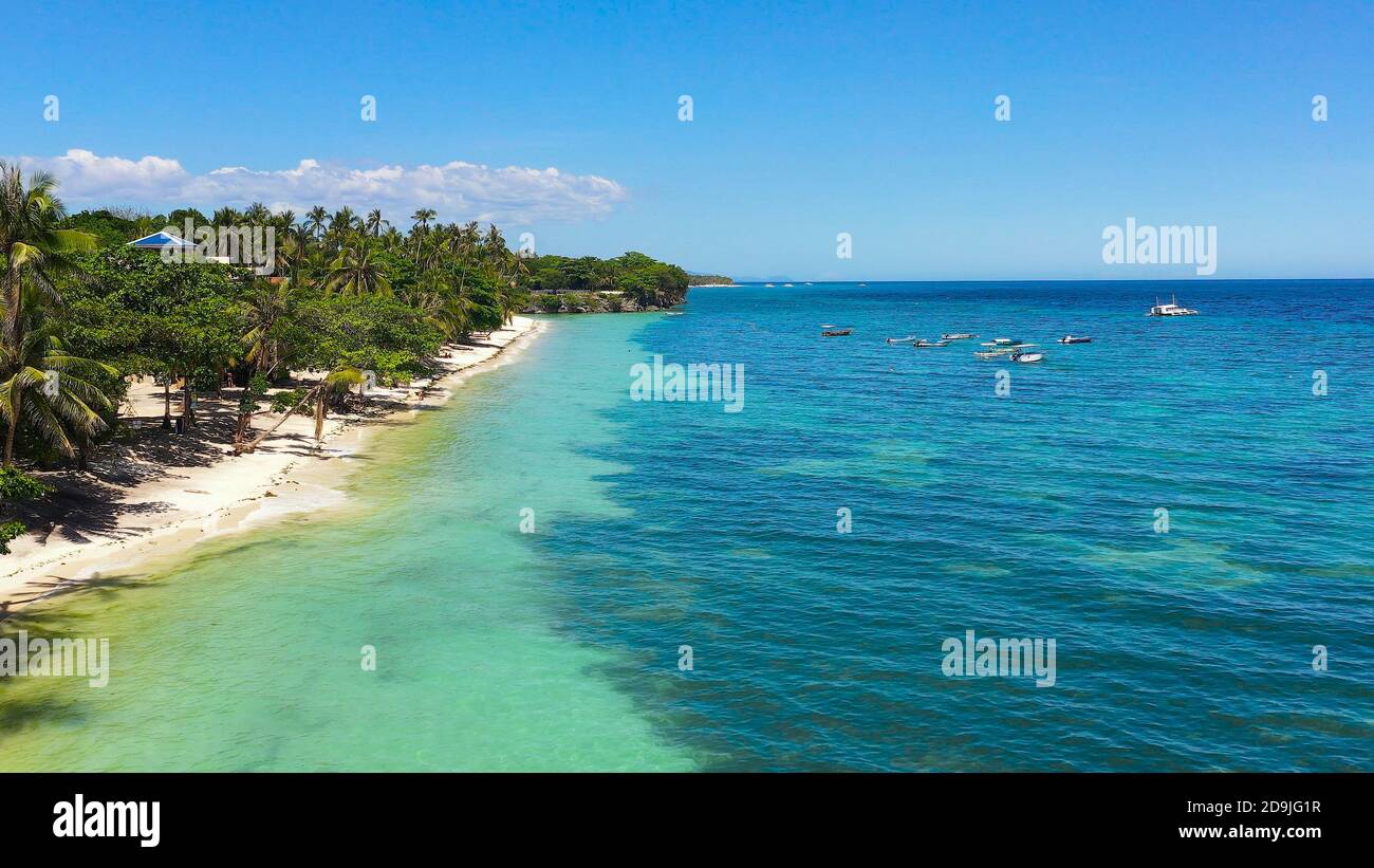 Beautiful tropical beach and turquoise water view from above. Alona ...