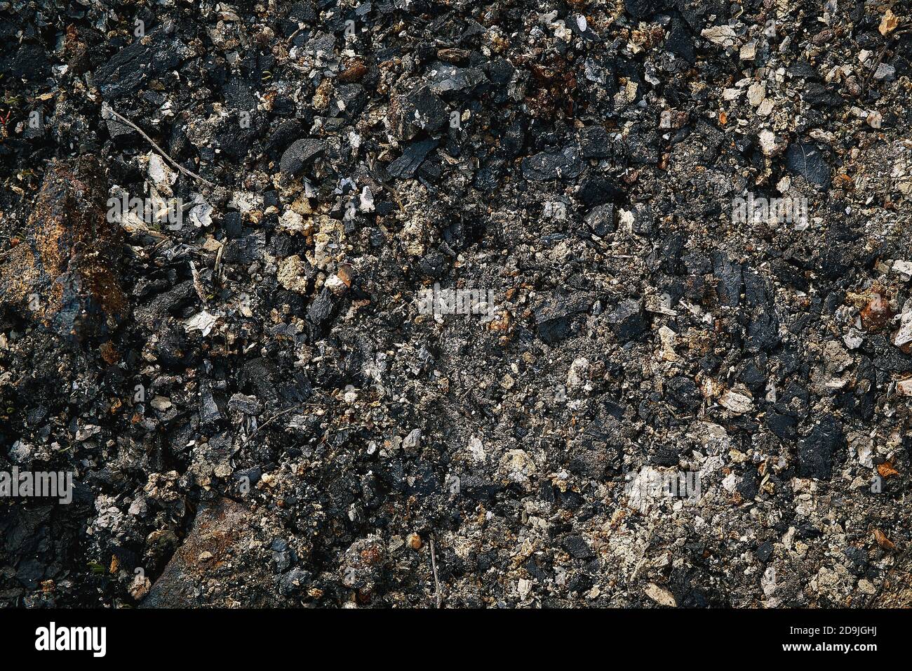 Pattern of different colours of small stones under the clear water with ...