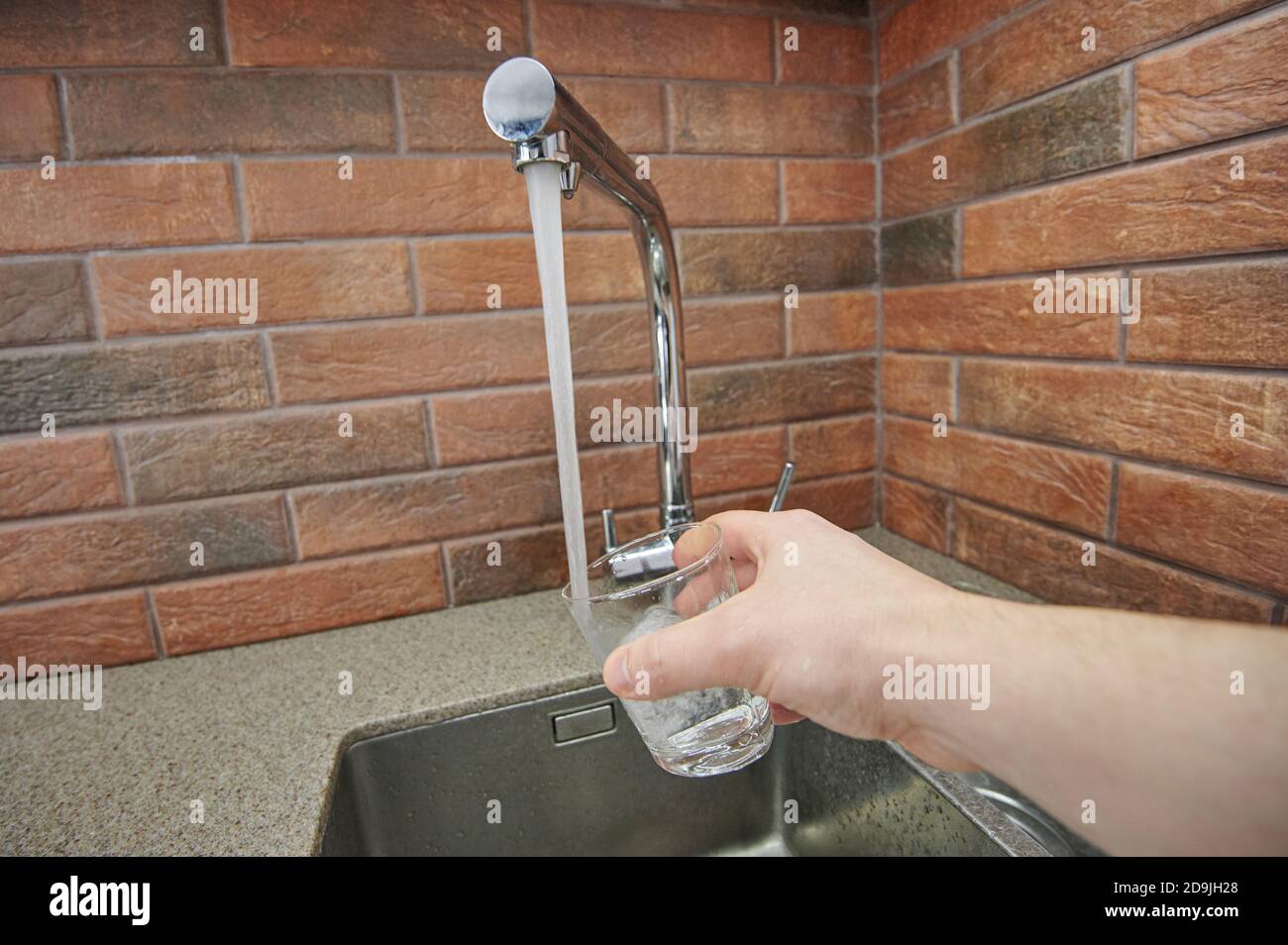 Filling glass with water from house faucet clsoe up view Stock Photo ...