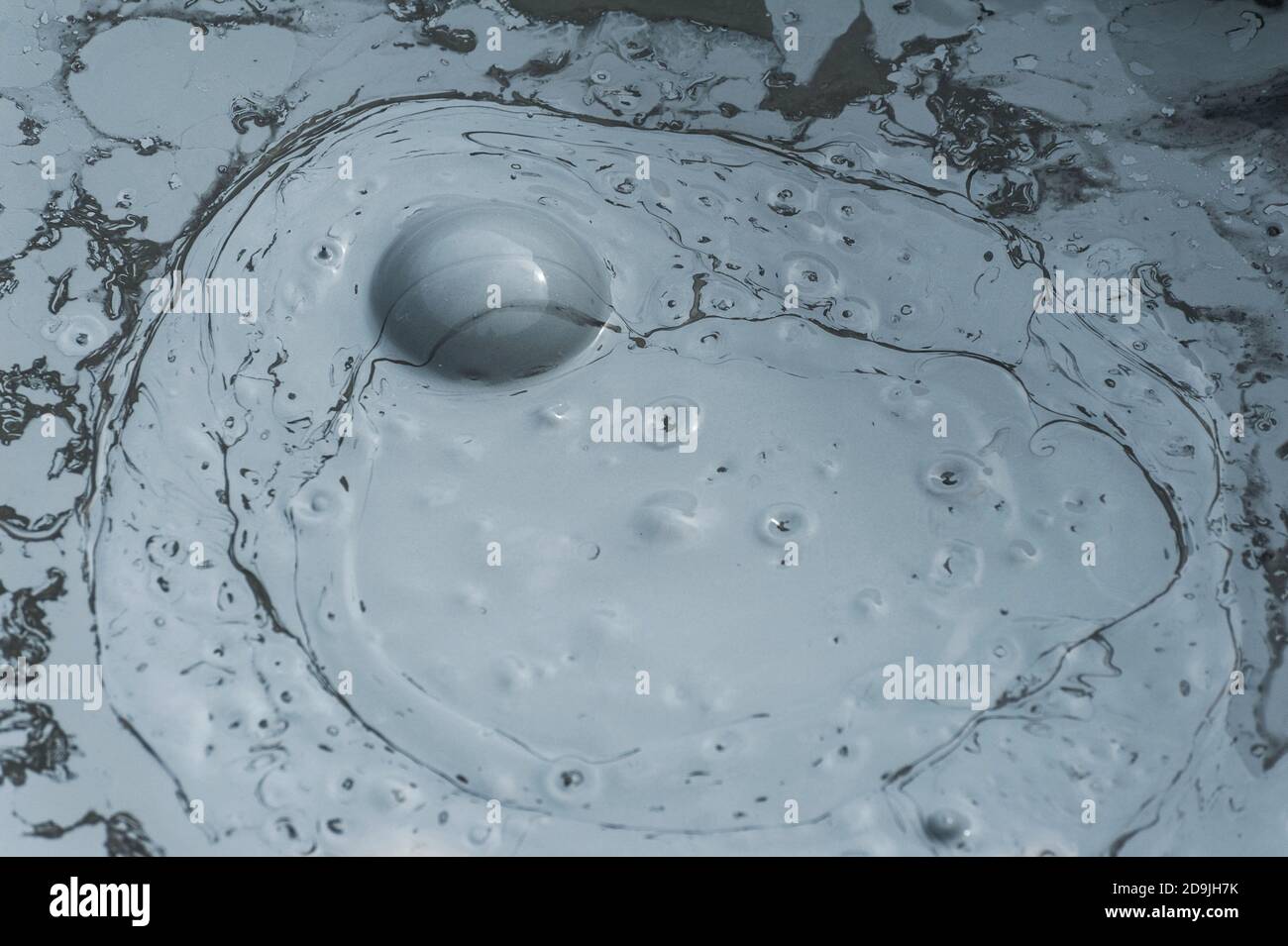 Hot boiling mud at fumarole is bubbling and exploding at mudpots ...