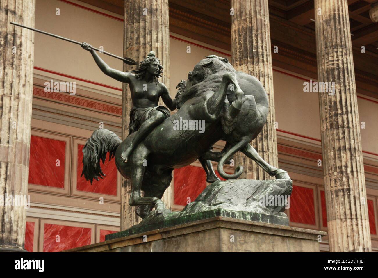 a statue of a man on a horse hunting lions at the gate of the old ...