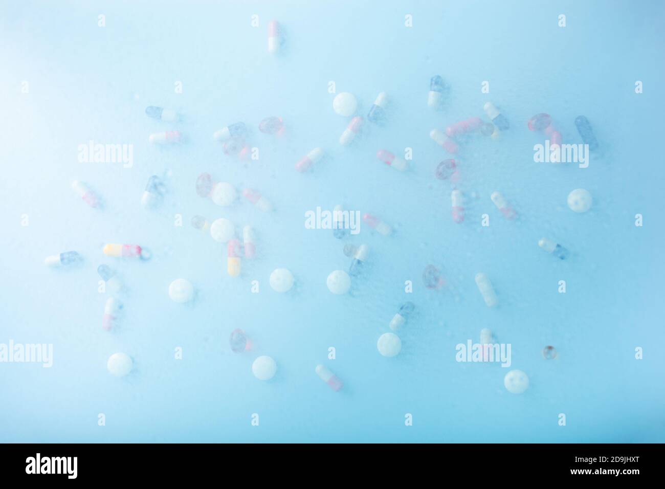 pill tablet capsule medicine through water drops background Stock Photo ...