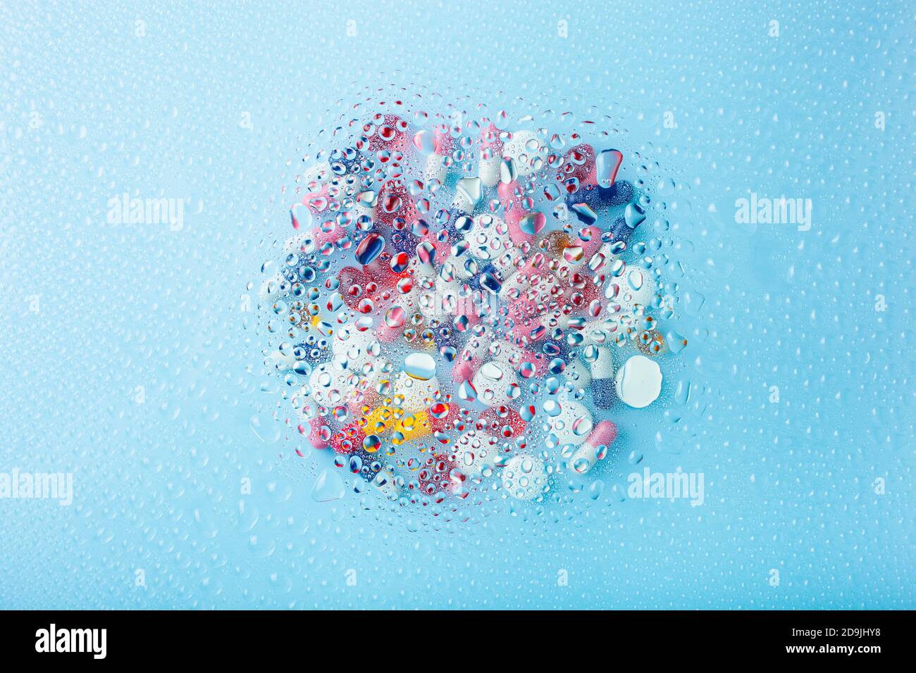 pill tablet capsule medicine through water drops background Stock Photo ...